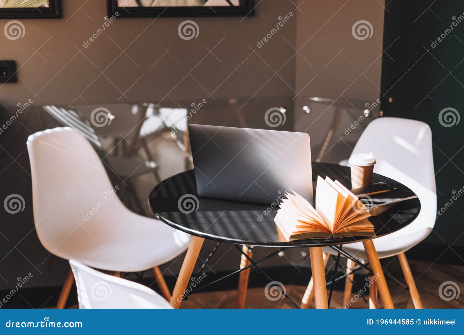 Computer Laptop with Coffee Cup and Open Book on the Black Table Stock ...