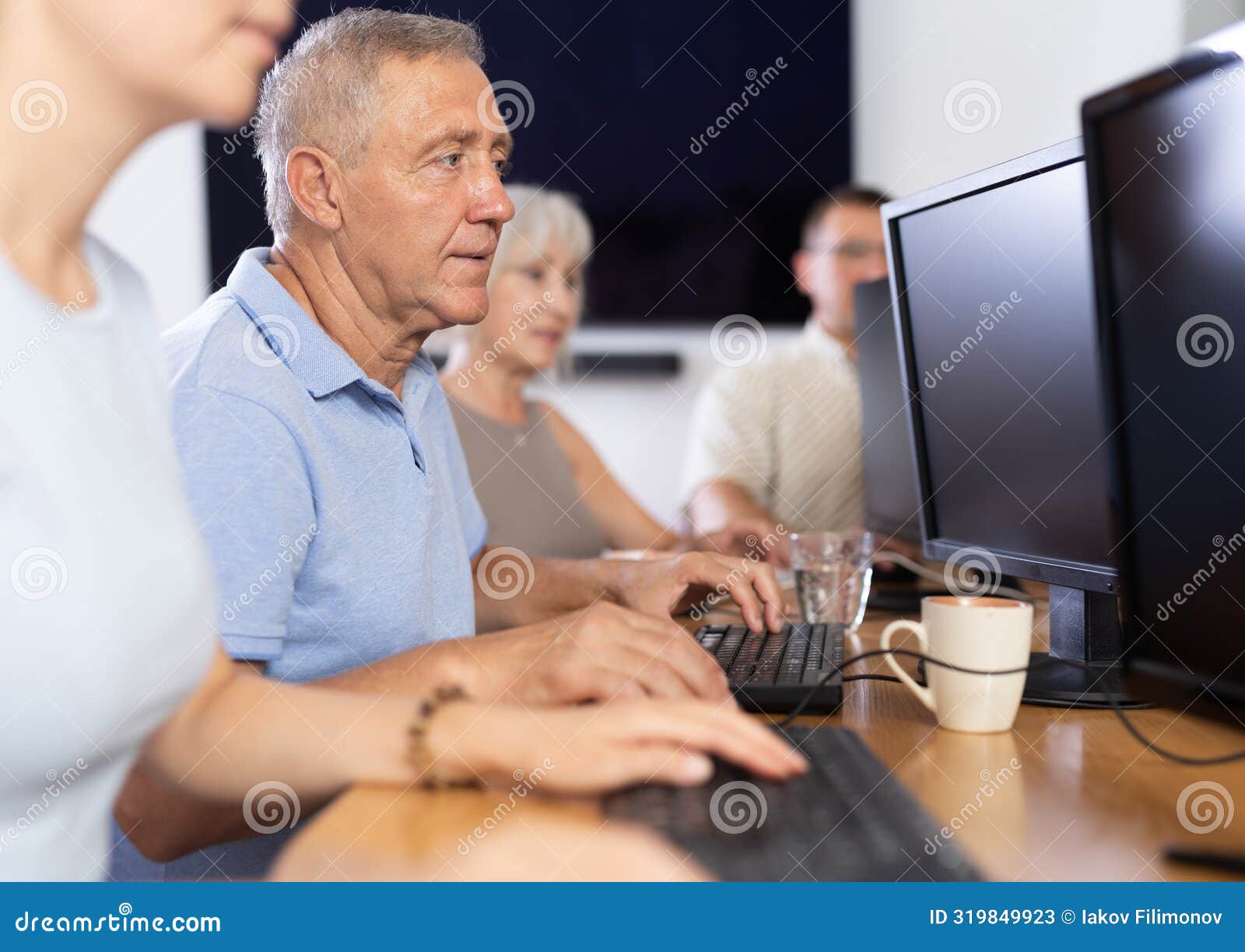 Computer Lessons For Elderly People In Nursing Home Group Of Seniors