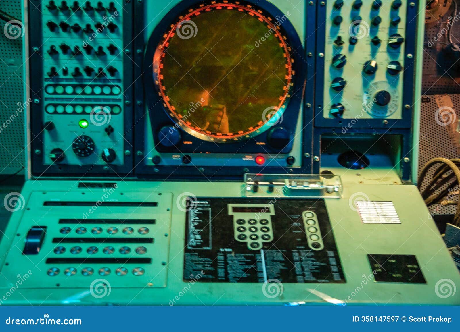 A Computer Monitor with a Green Screen and a Dial on the Left Side ...