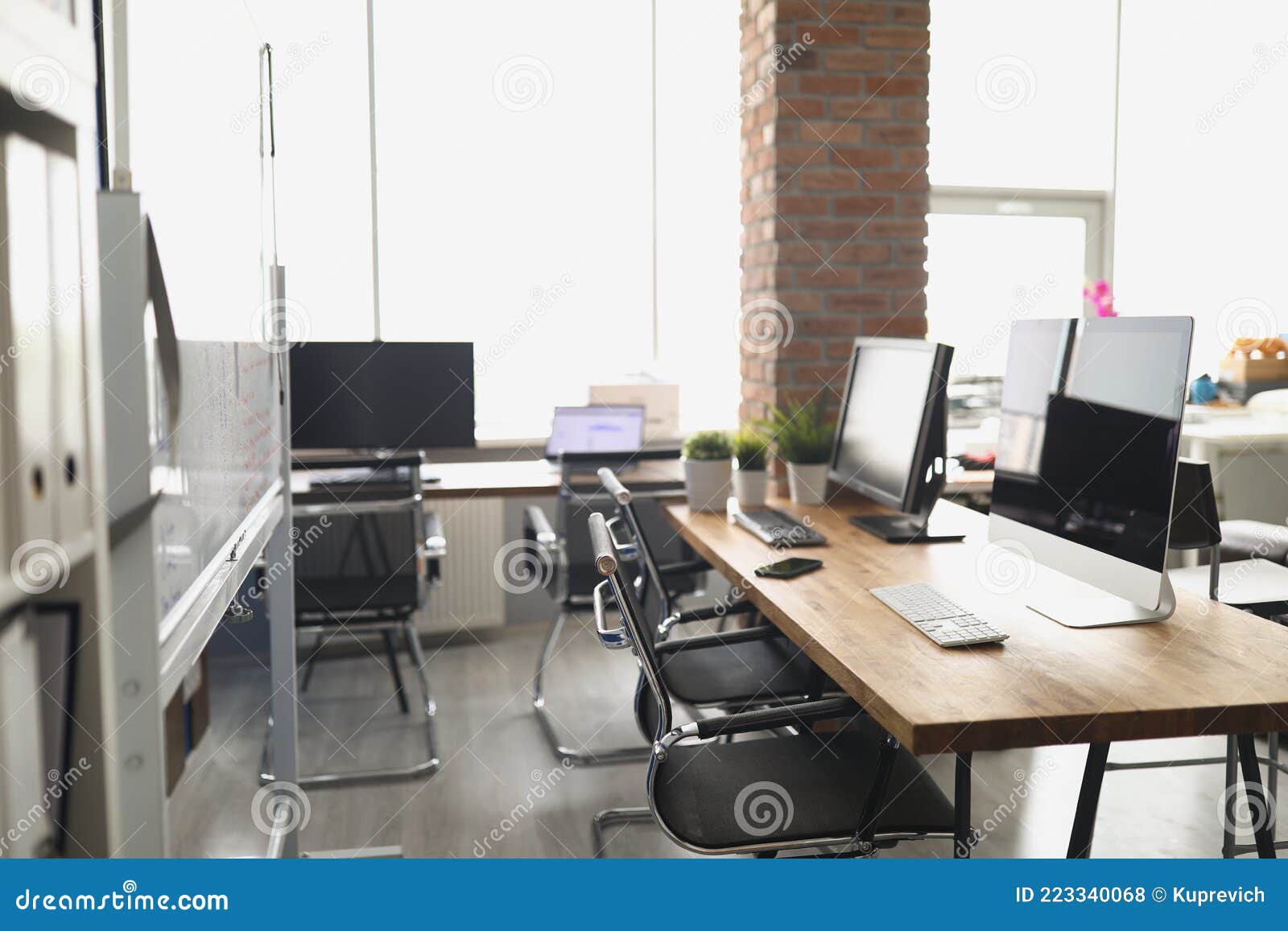 Computer Monitors Standing on Table in Empty Office Stock Photo - Image ...