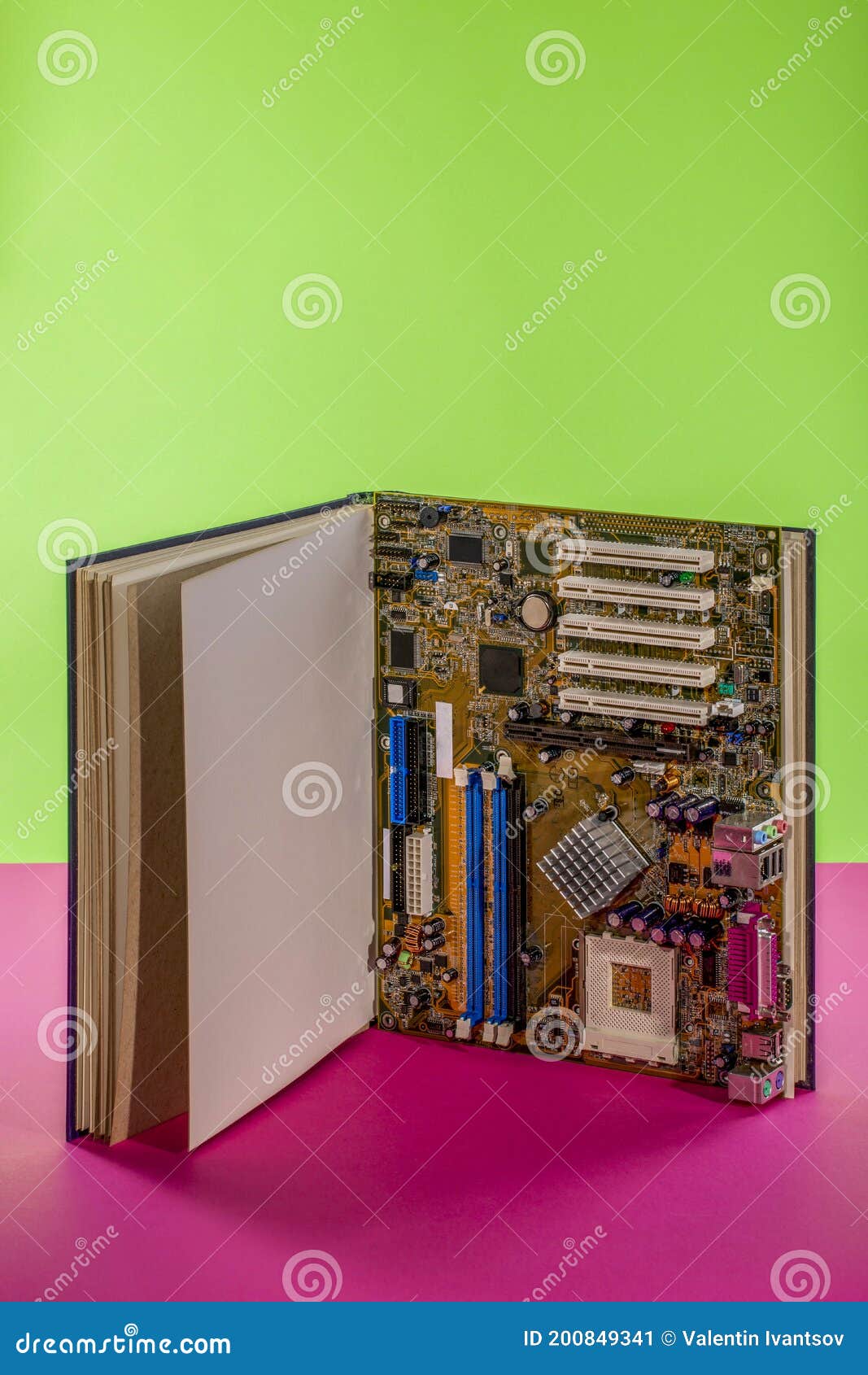 Computer Motherboard in a Large Open Book on a Colored Background Stock ...