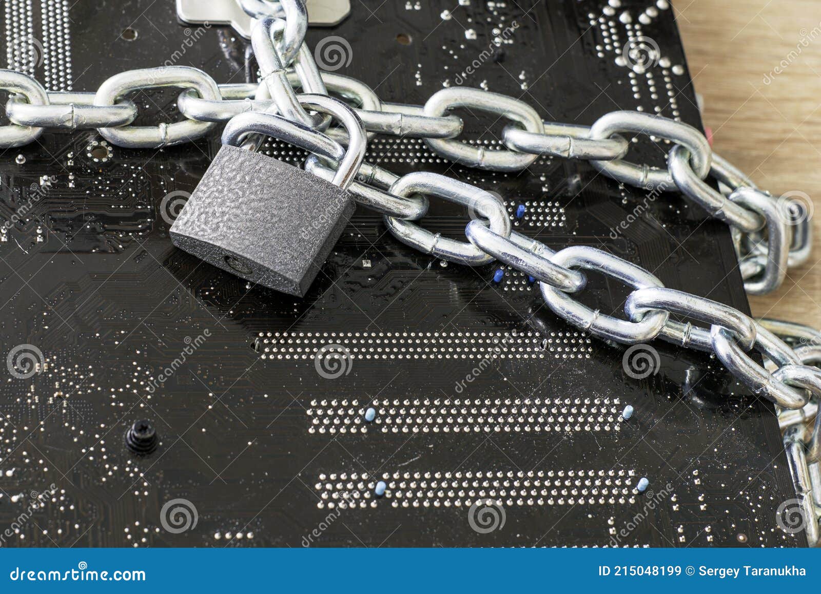 The Computer Motherboard is Wrapped with an Iron Chain Locked with a ...