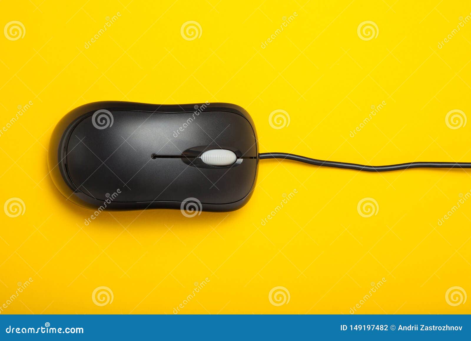 Computer Mouse with Cord on a Yellow Background. View from Above Stock ...