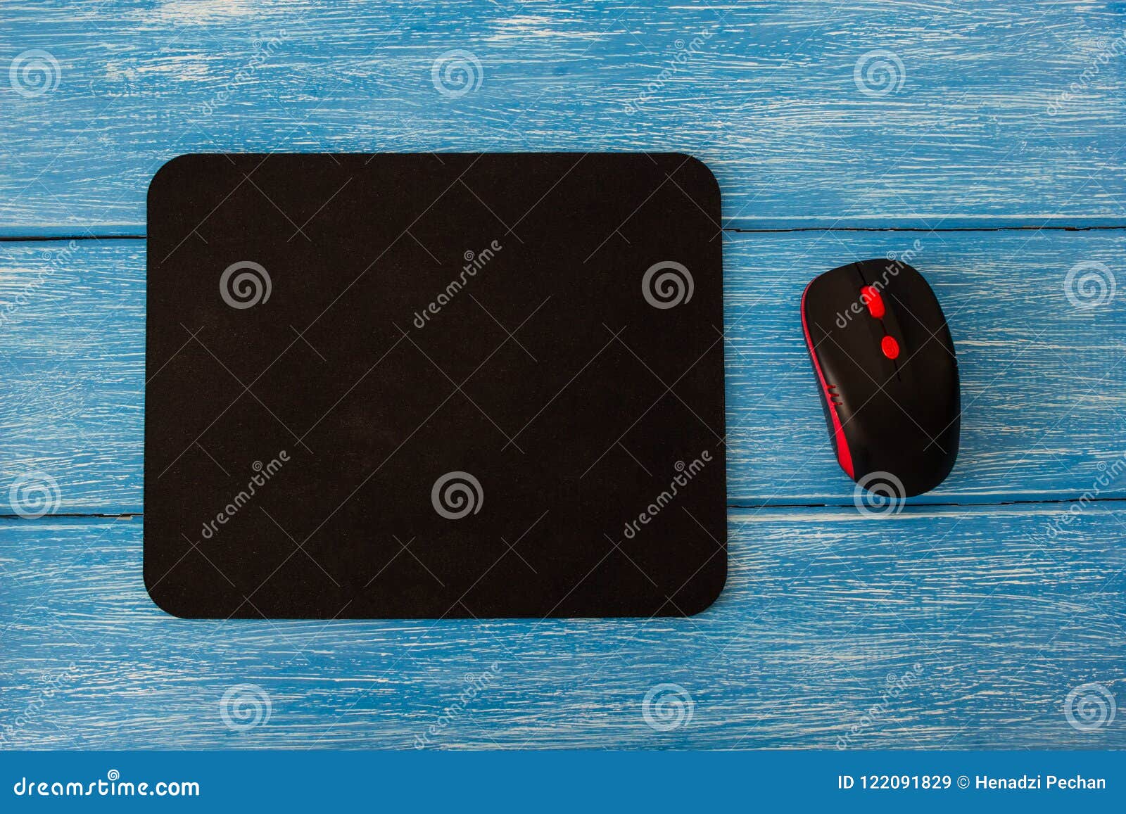 Computer Mouse Pad and Mouse on a Blue Wooden Background Mouse Stock ...