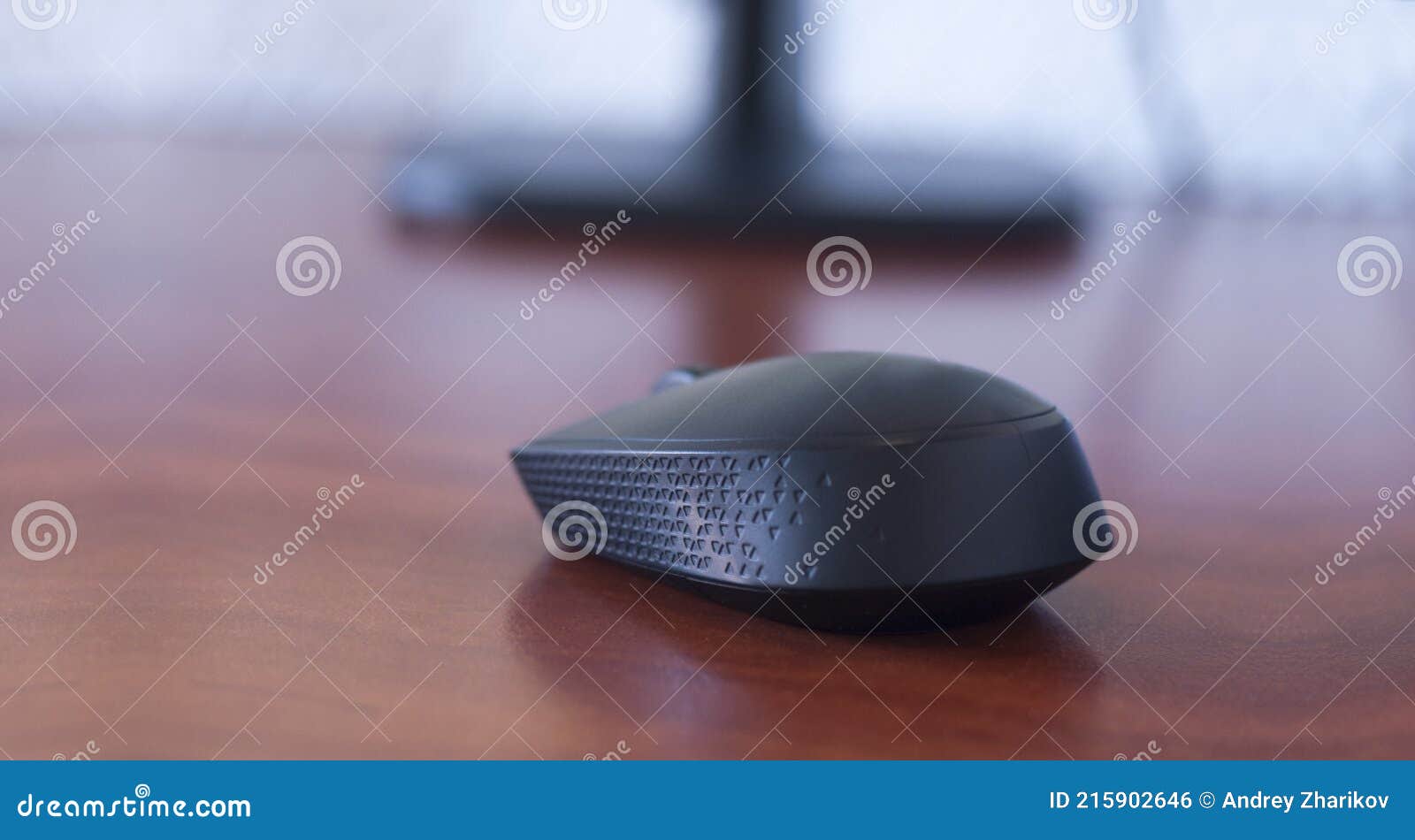 Computer Mouse on the Table. Black Color. on a Wooden Background Stock ...