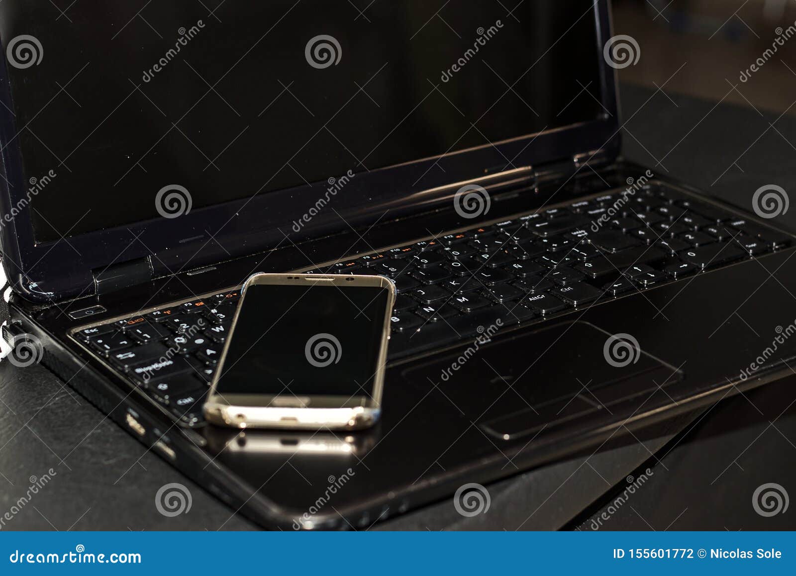 The Computer Next To the Cell Phone on an Eco-leather Table Stock Photo ...