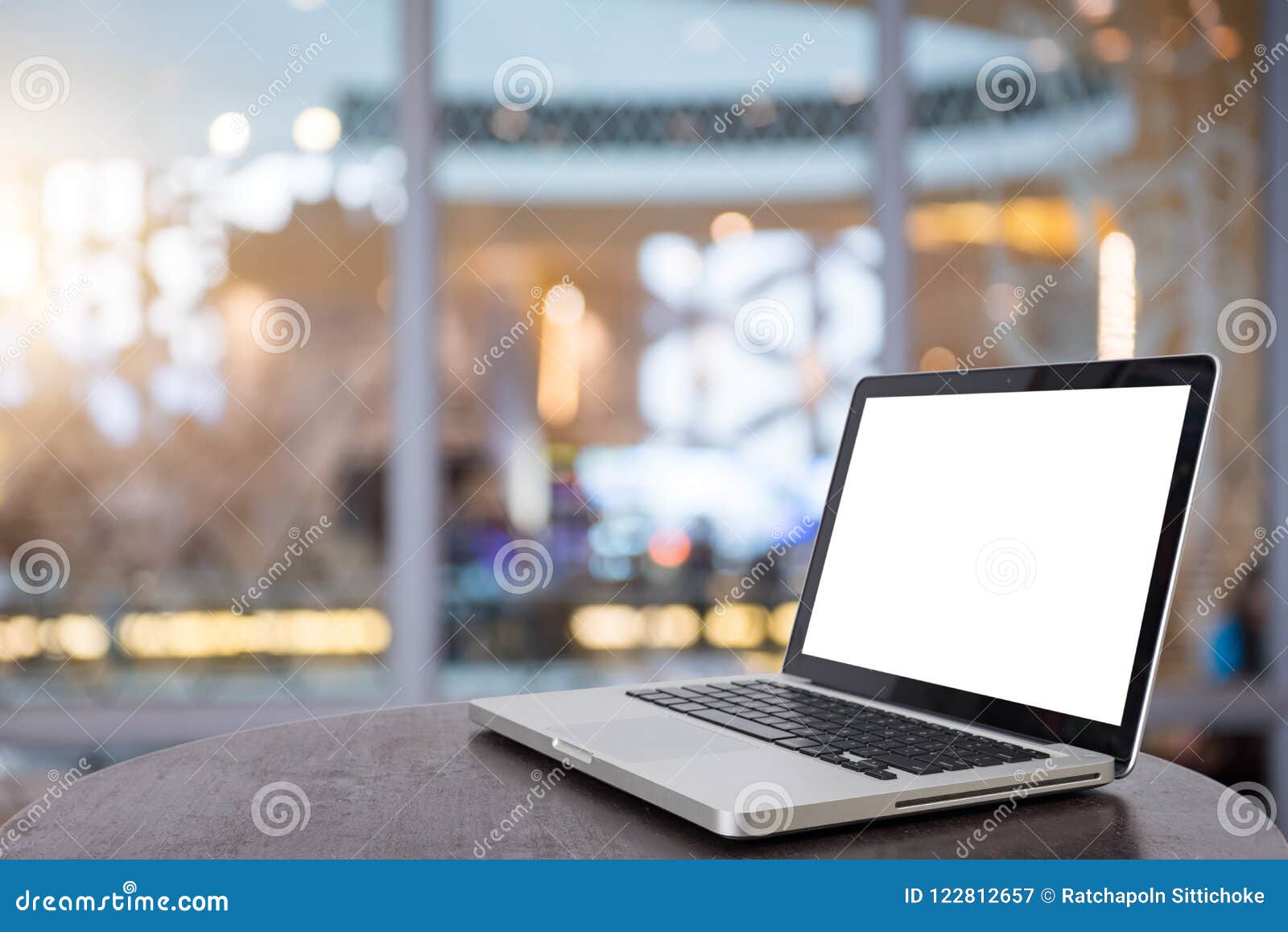 Computer Notebook with a Coffee Shop Behind the Scenes Blur Coffee Shop ...