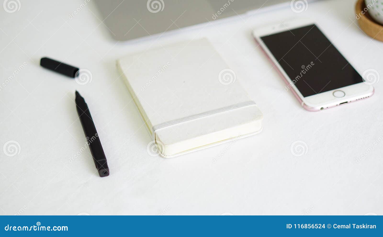 Computer Phone and Notepad on the White Background Table Stock Photo ...