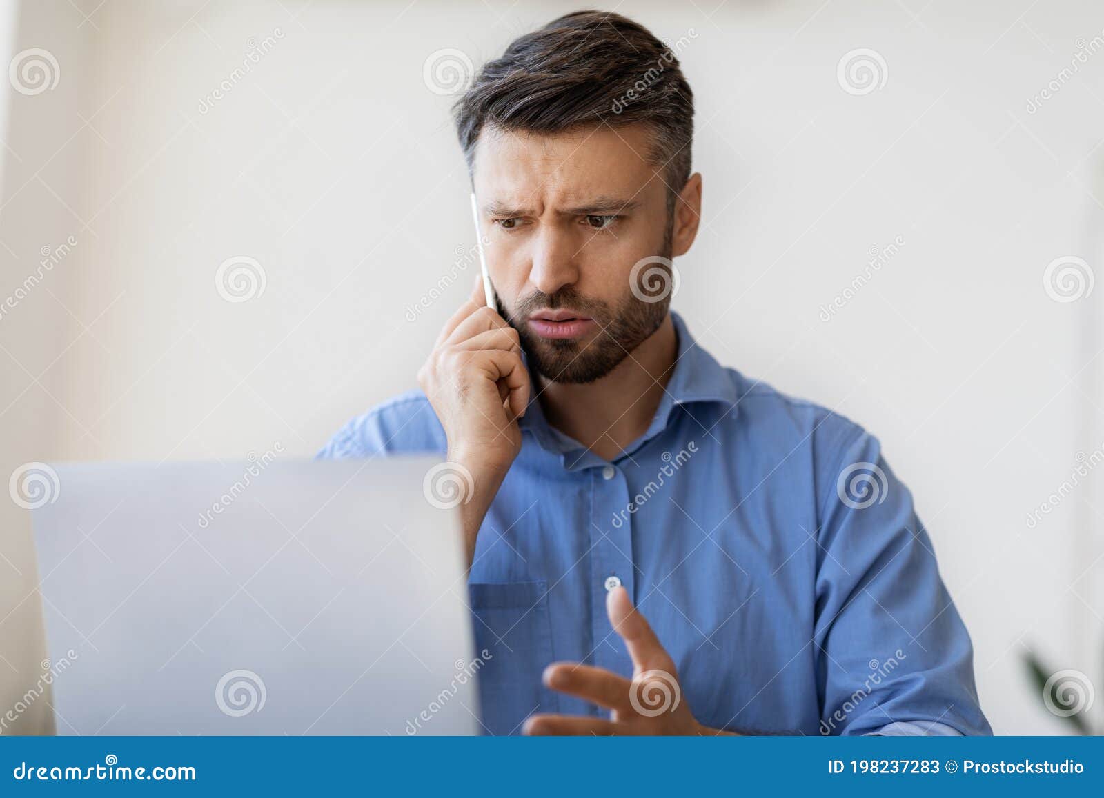 Computer Problem. Concerned Millennial Businessman Talking on Cellphone ...