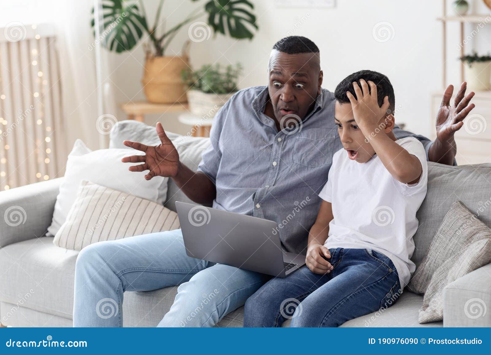 Computer Problem. Shocked Black Boy and His Grandfather Looking at ...