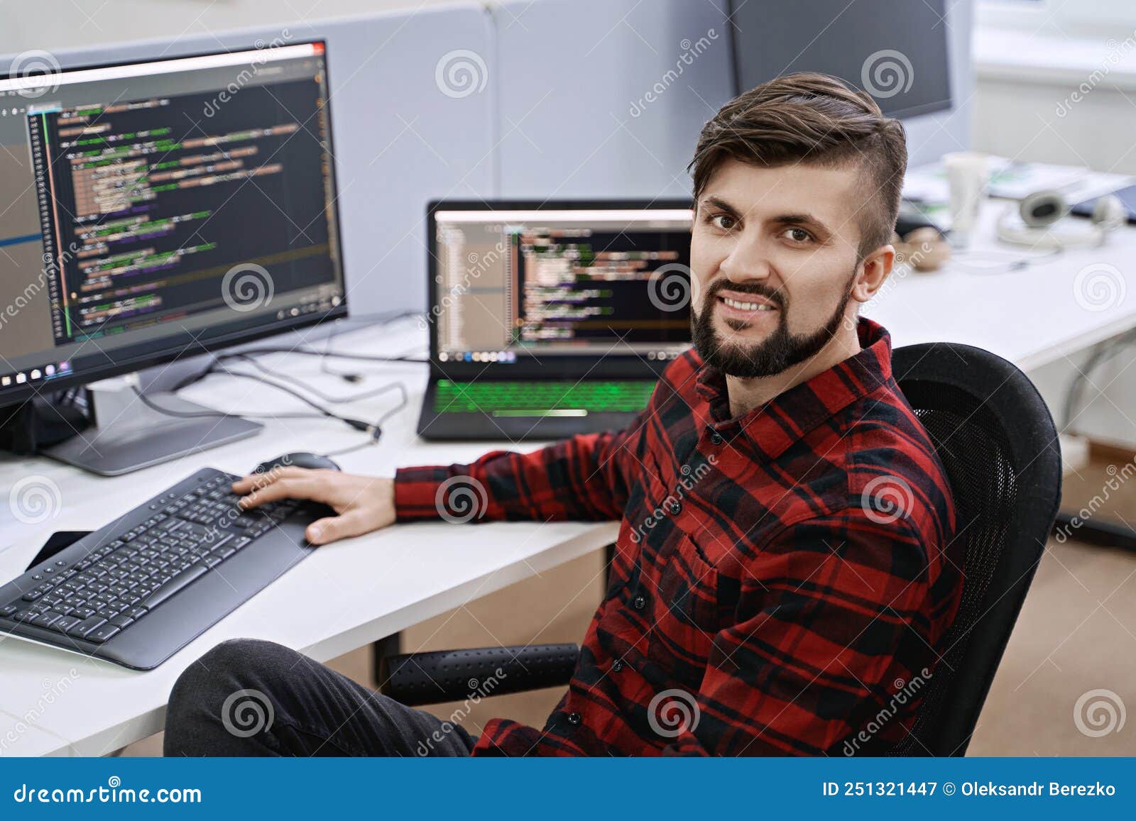 Computer Programmer Developer Working in it Office, Sitting at Desk and ...
