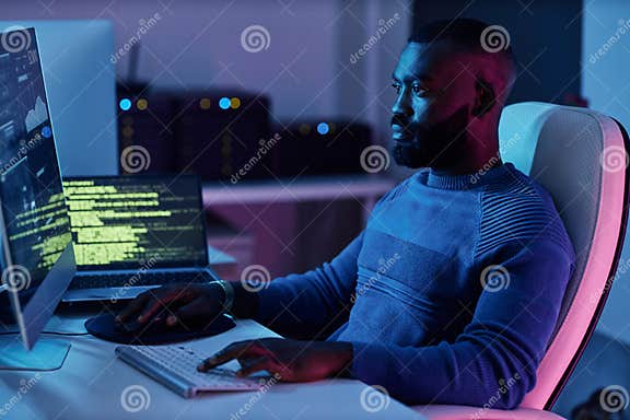 Computer Programmer Working in Neon Light Stock Image - Image of production, beard: 259368939