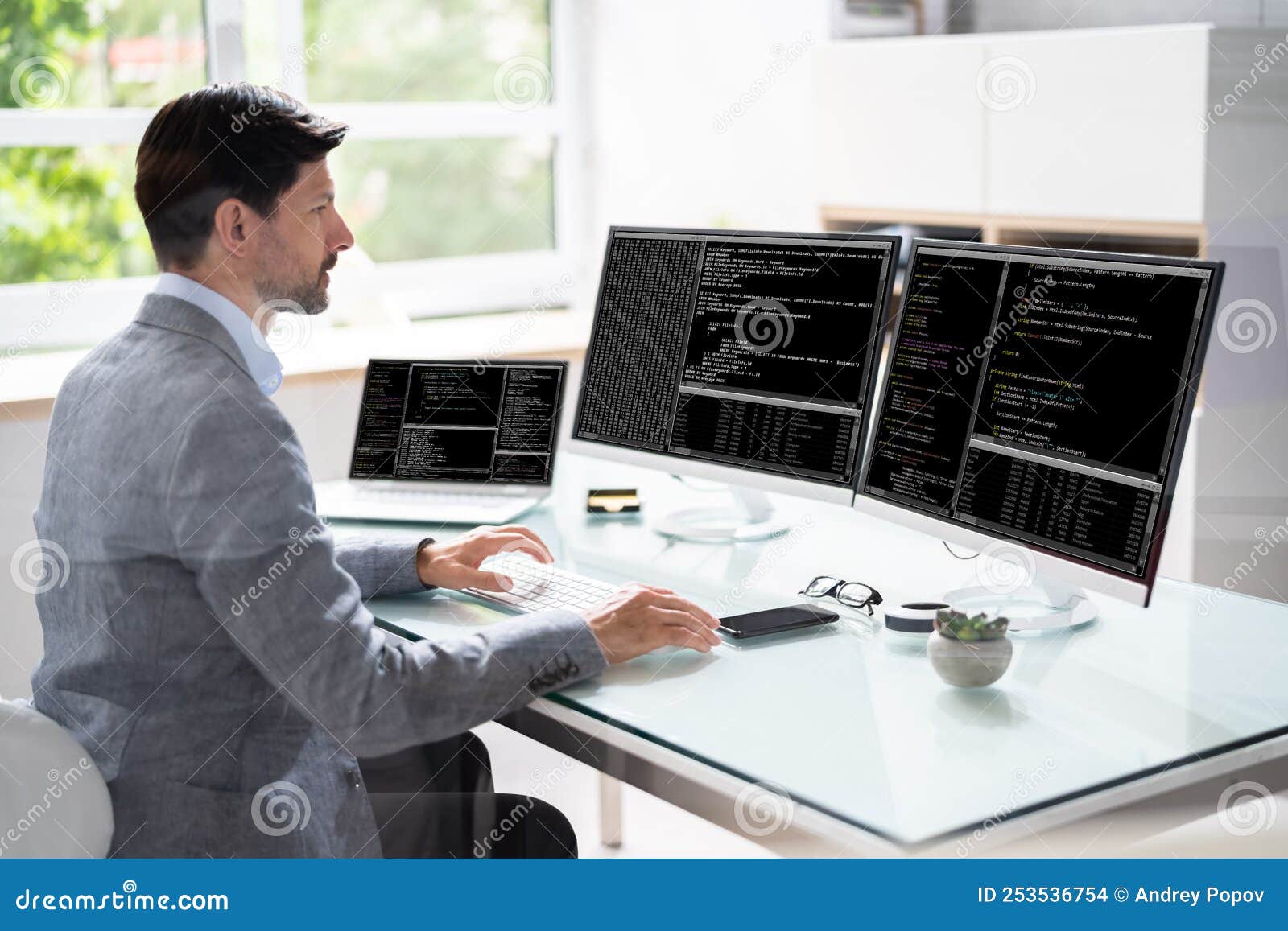 Computer Programmer Writing Program Code on Computer Stock Photo ...