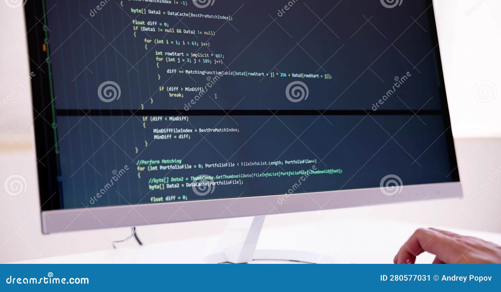 Computer Programmer Writing Program Code On Computer Stock Image