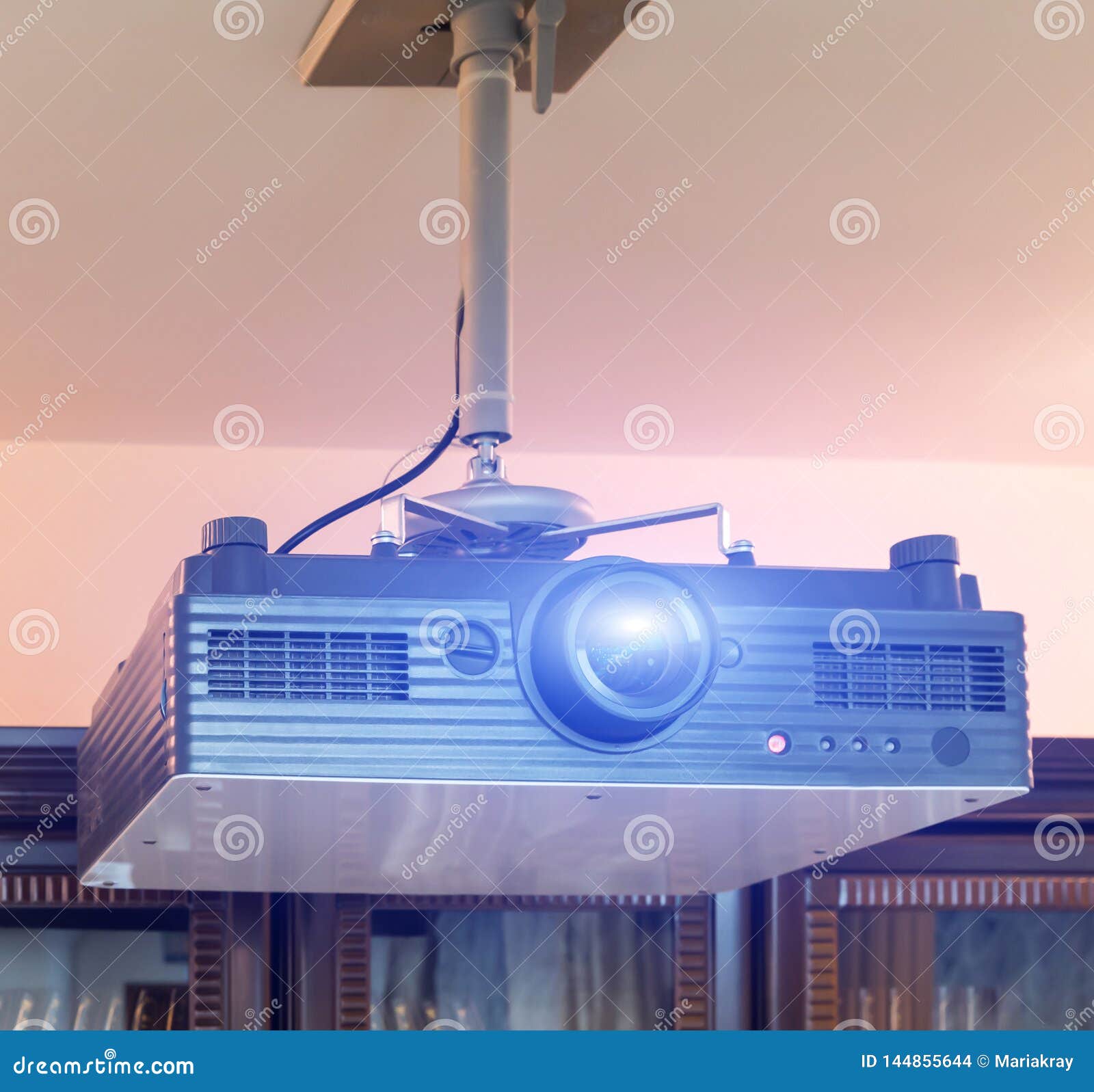 Computer Projector Wih Blue Light Flare Anging in Conference Hall Stock ...