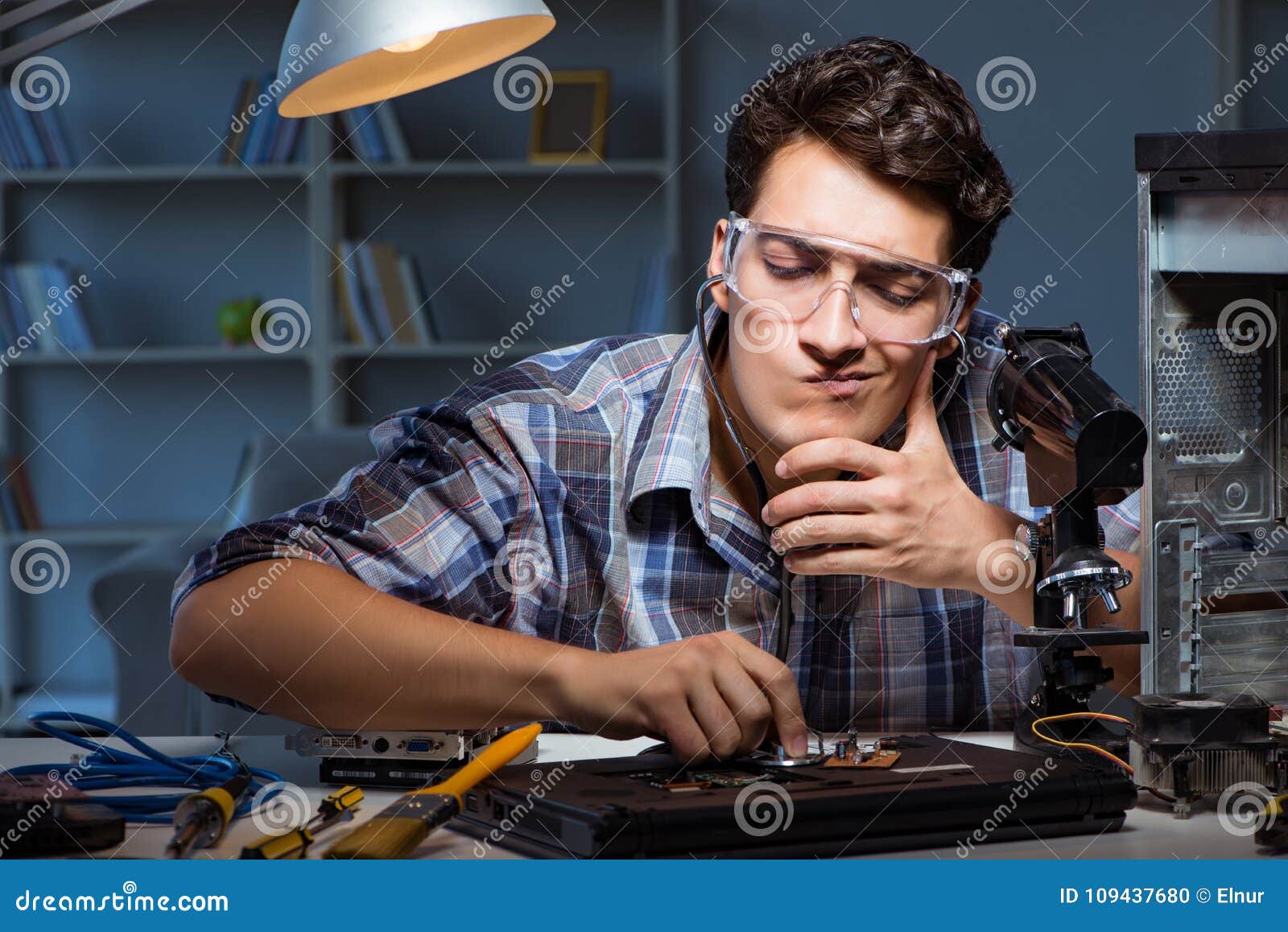 The Computer Repair Concept with Man Inspecting with Stethoscope Stock ...
