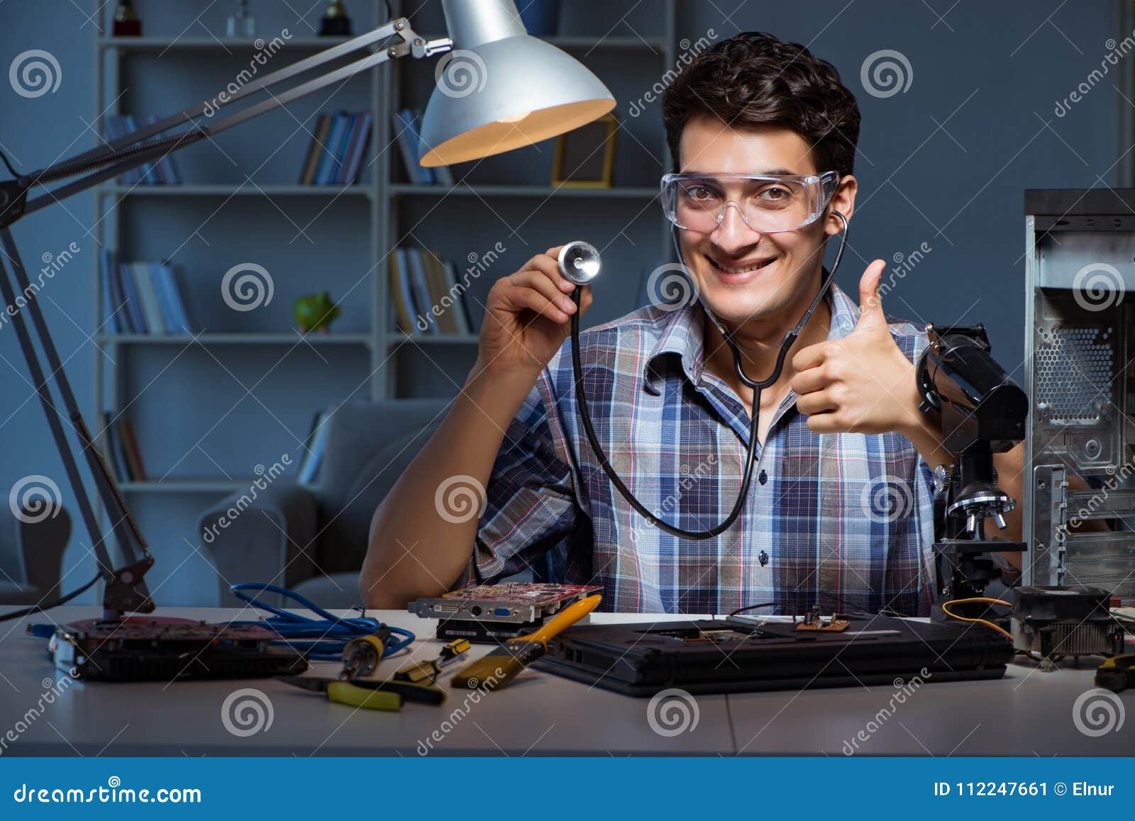 The Computer Repair Concept with Man Inspecting with Stethoscope Stock ...