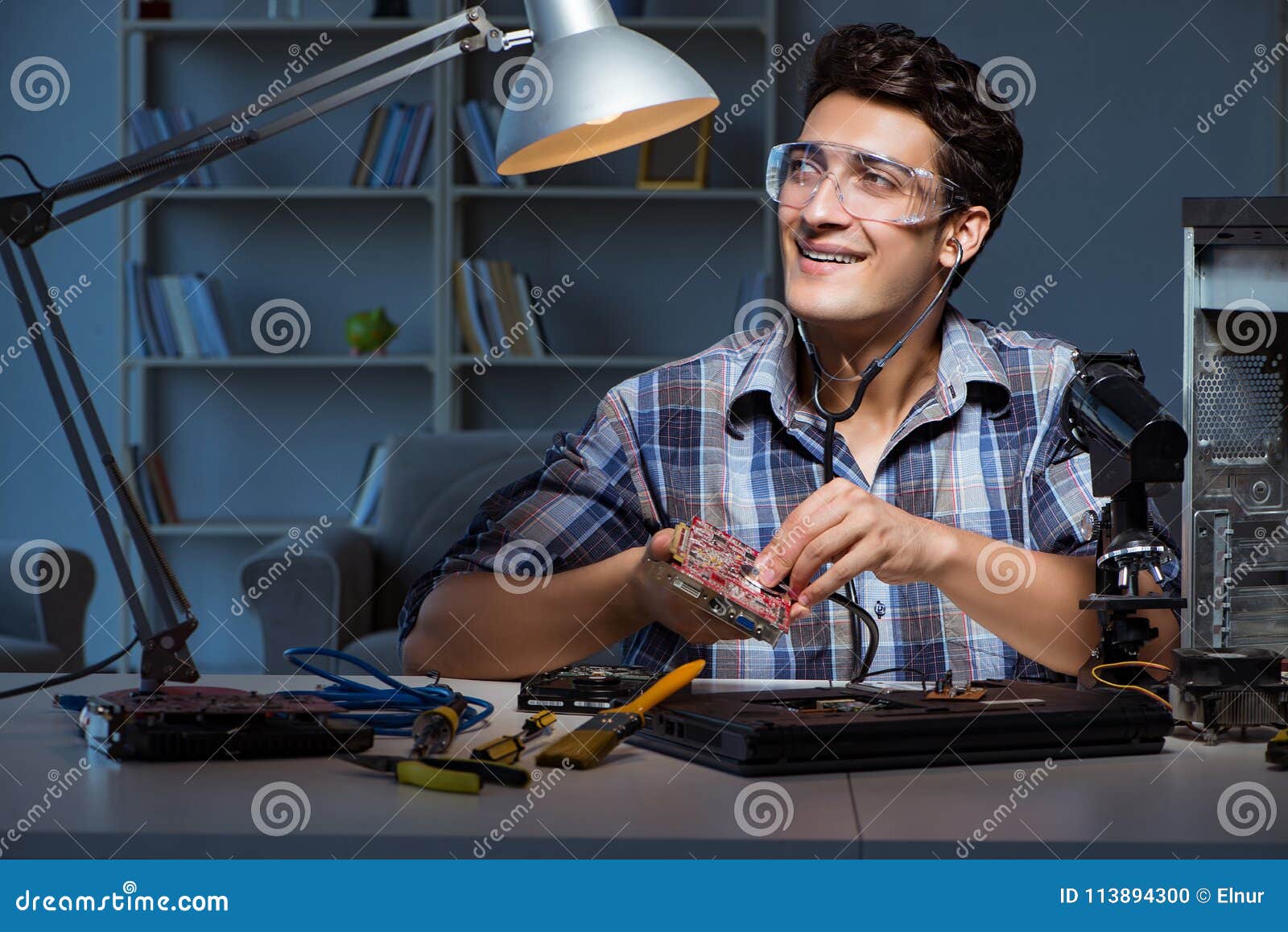 The Computer Repair Concept with Man Inspecting with Stethoscope Stock ...