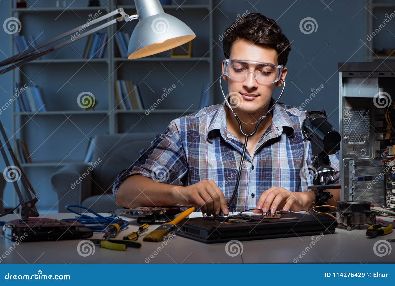 The Computer Repair Concept with Man Inspecting with Stethoscope Stock ...