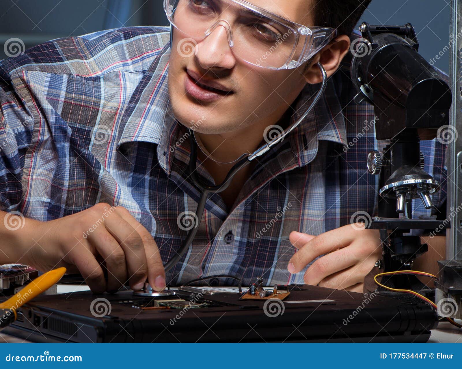 Computer Repair Concept with Man Inspecting with Stethoscope Stock ...
