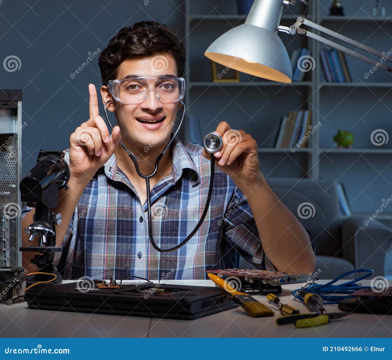 Computer Repair Concept with Man Inspecting with Stethoscope Stock ...