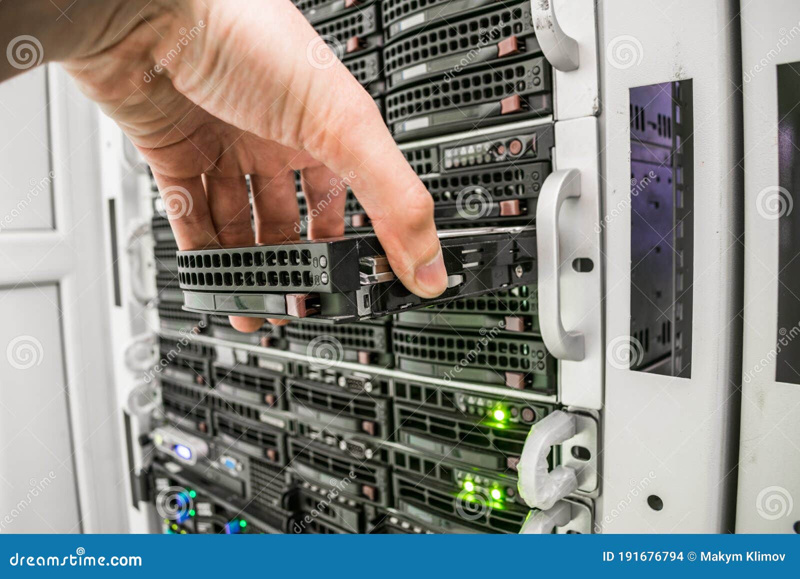 Computer Repair in the Server Room of the Data Center. the Specialist ...