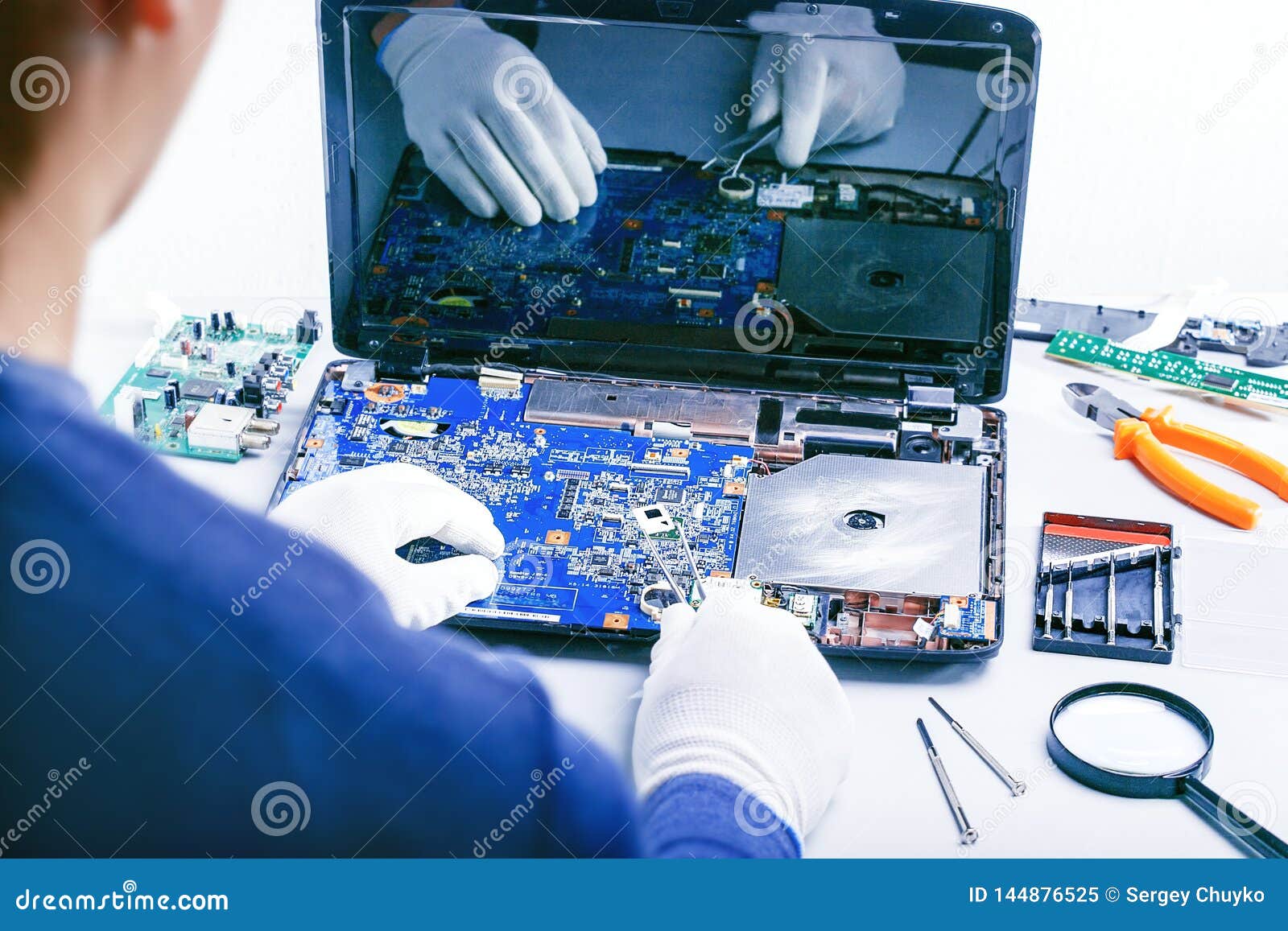 Tech Fixes Motherboard in Service Center. Repair Laptop. Stock Image ...