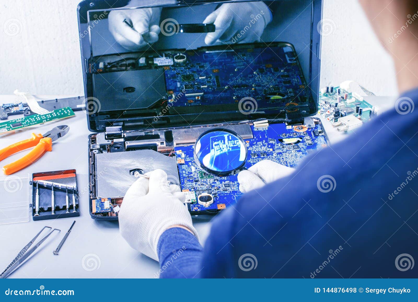 Computer Repair. Tech Fixes Motherboard. Small Business. Stock Photo ...