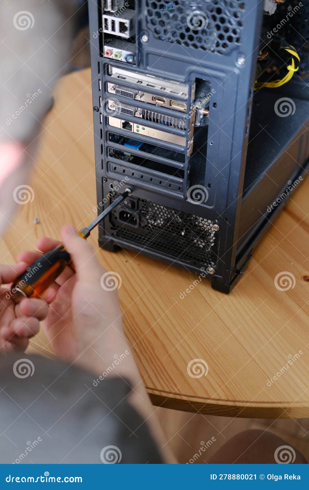 A Man Disassembles a Computer System Unit with a Screwdriver Stock ...