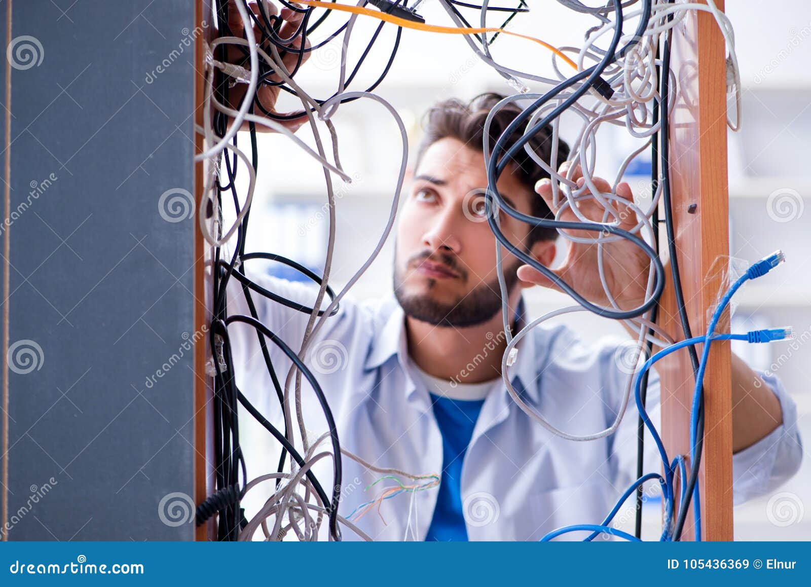The Computer Repairman Working on Repairing Network in it Workshop ...