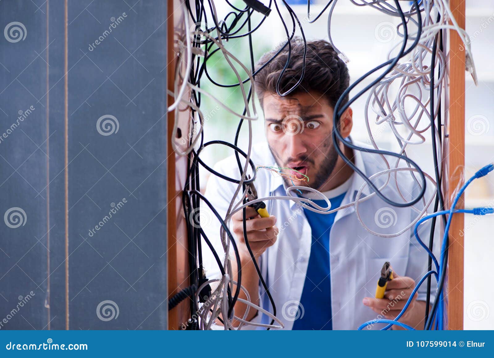 The Computer Repairman Working on Repairing Network in it Workshop ...