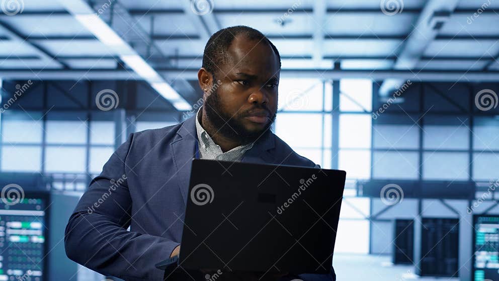 Computer Scientist in Data Center Using Diagnostic Tools on Laptop Stock Image - Image of ...