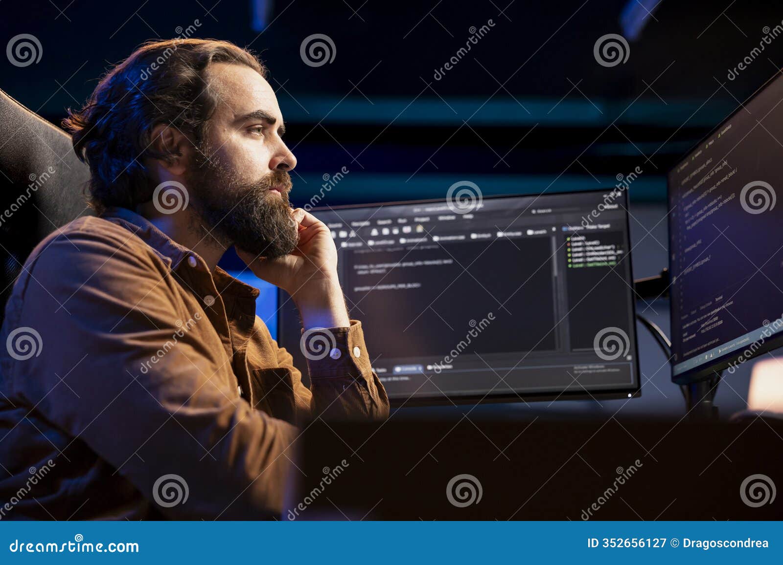 System Admin in Living Room Inspecting Lines of Code on Desktop PC ...