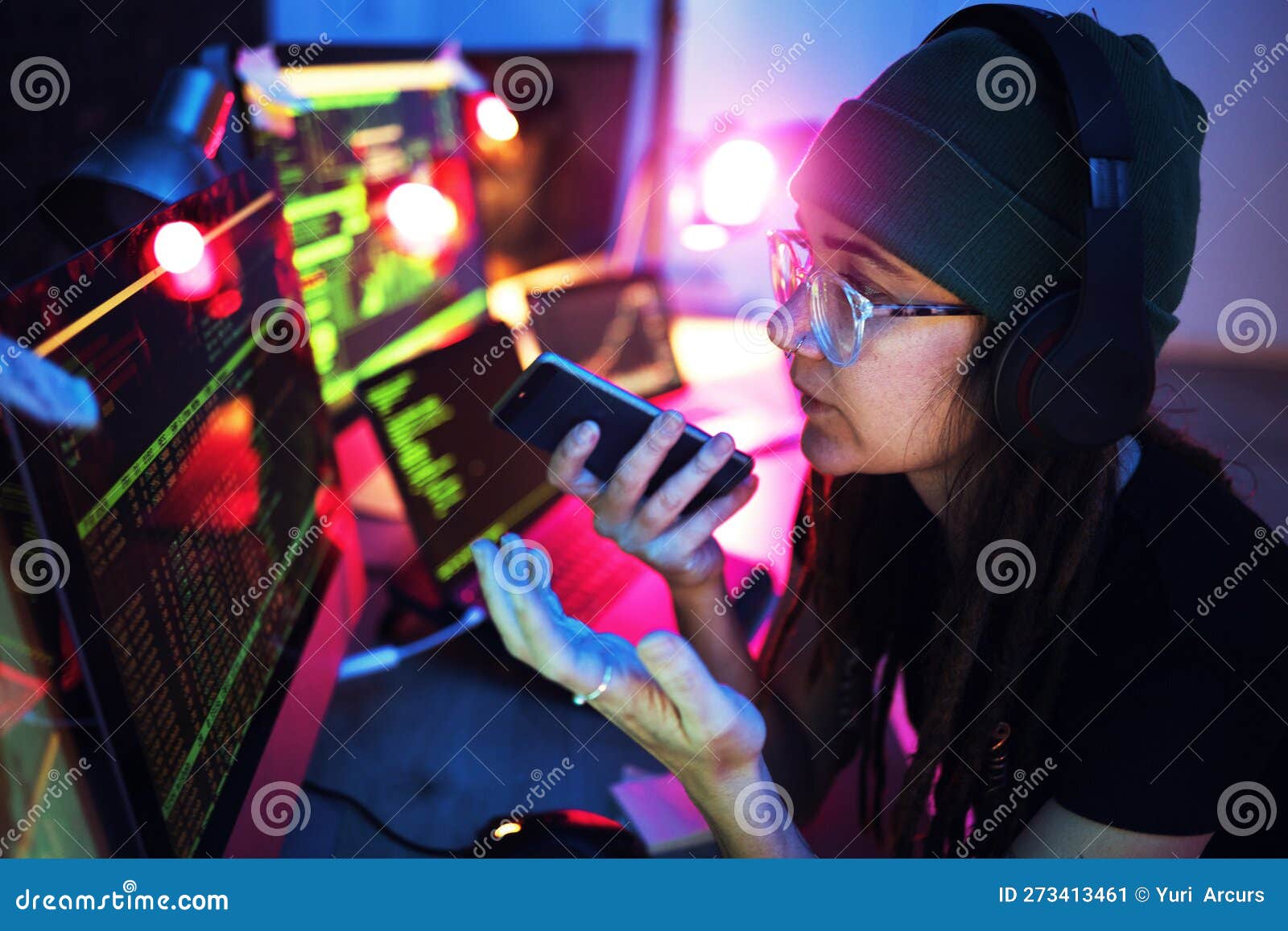 Girl Hacker In A Hood Typing Program Code While Committing A Cybercrime Hacking A Firewall On
