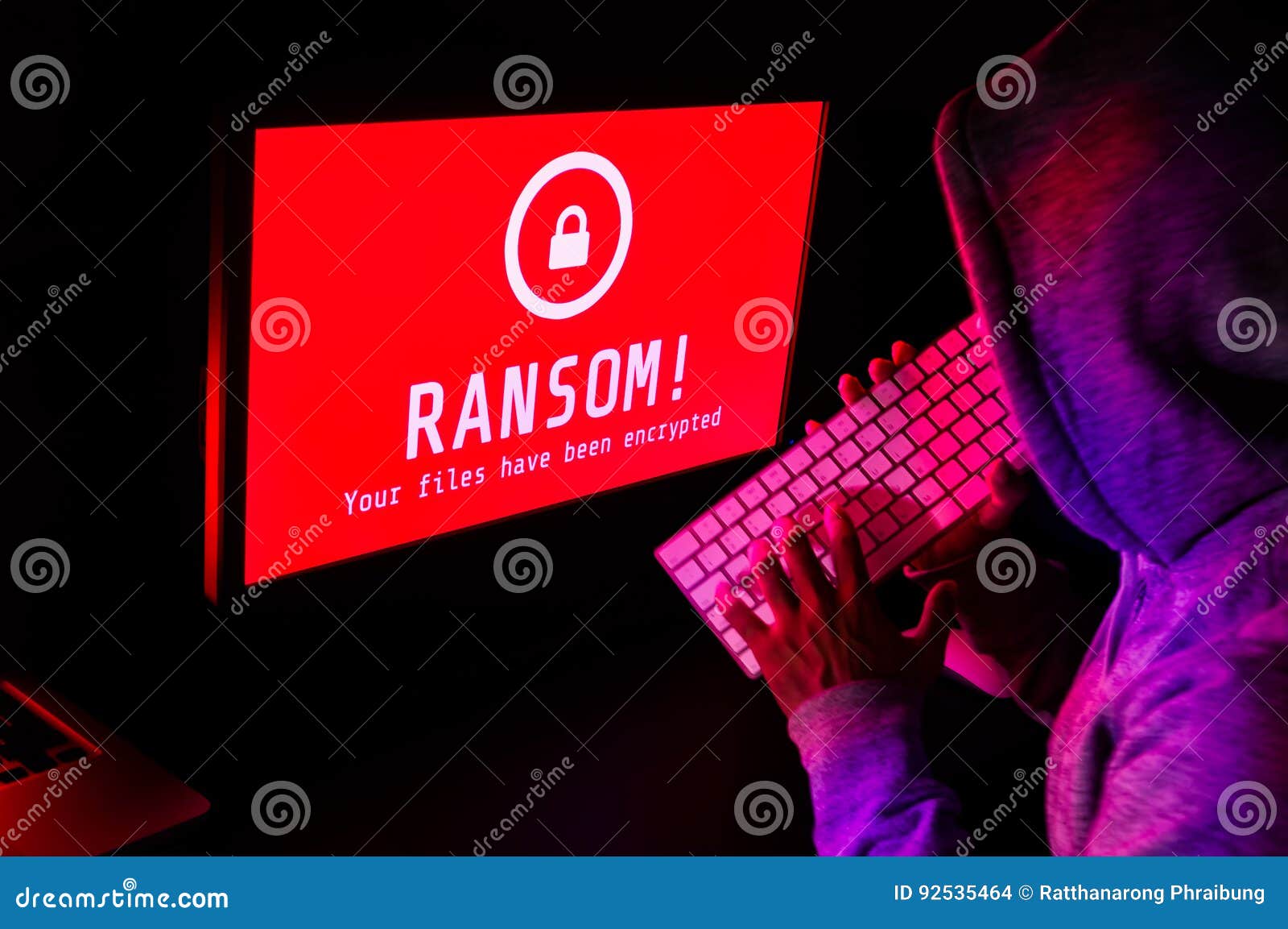 Computer Screen with Ransomware Attack Alert in Red and a Hacker Stock ... Computer Screen with Ransomware Attack Alert in Red and a Hacker Stock ...