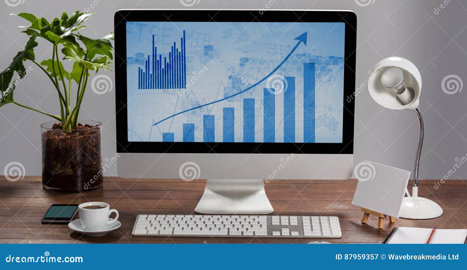 Computer Showing Charts and Graphs on the Screen with Cup of Coffee and ...