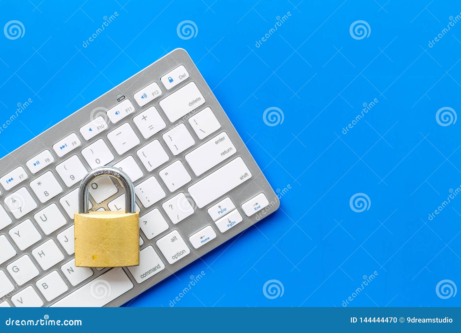 Computer System Protection from Hacker with Locker and Keyboard on Blue ...