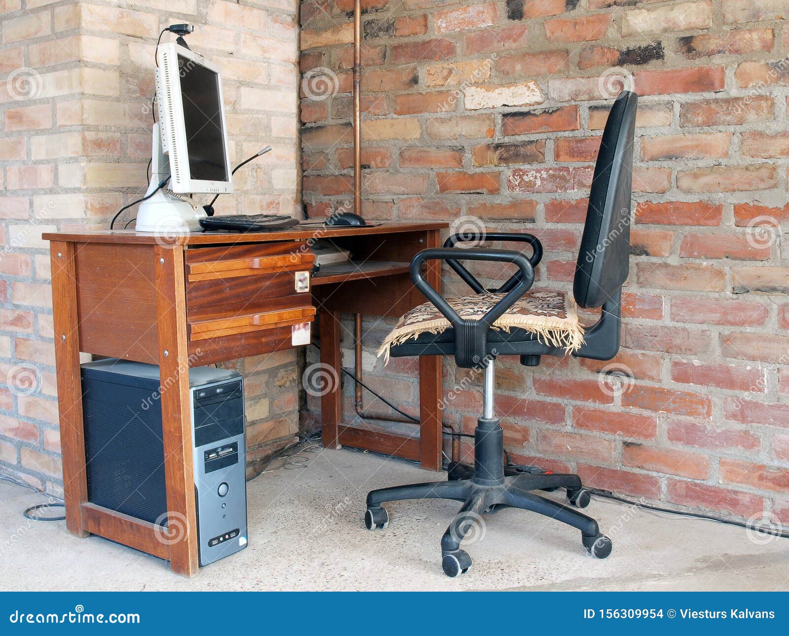 Computer table stock photo. Image of brick, room, working - 156309954