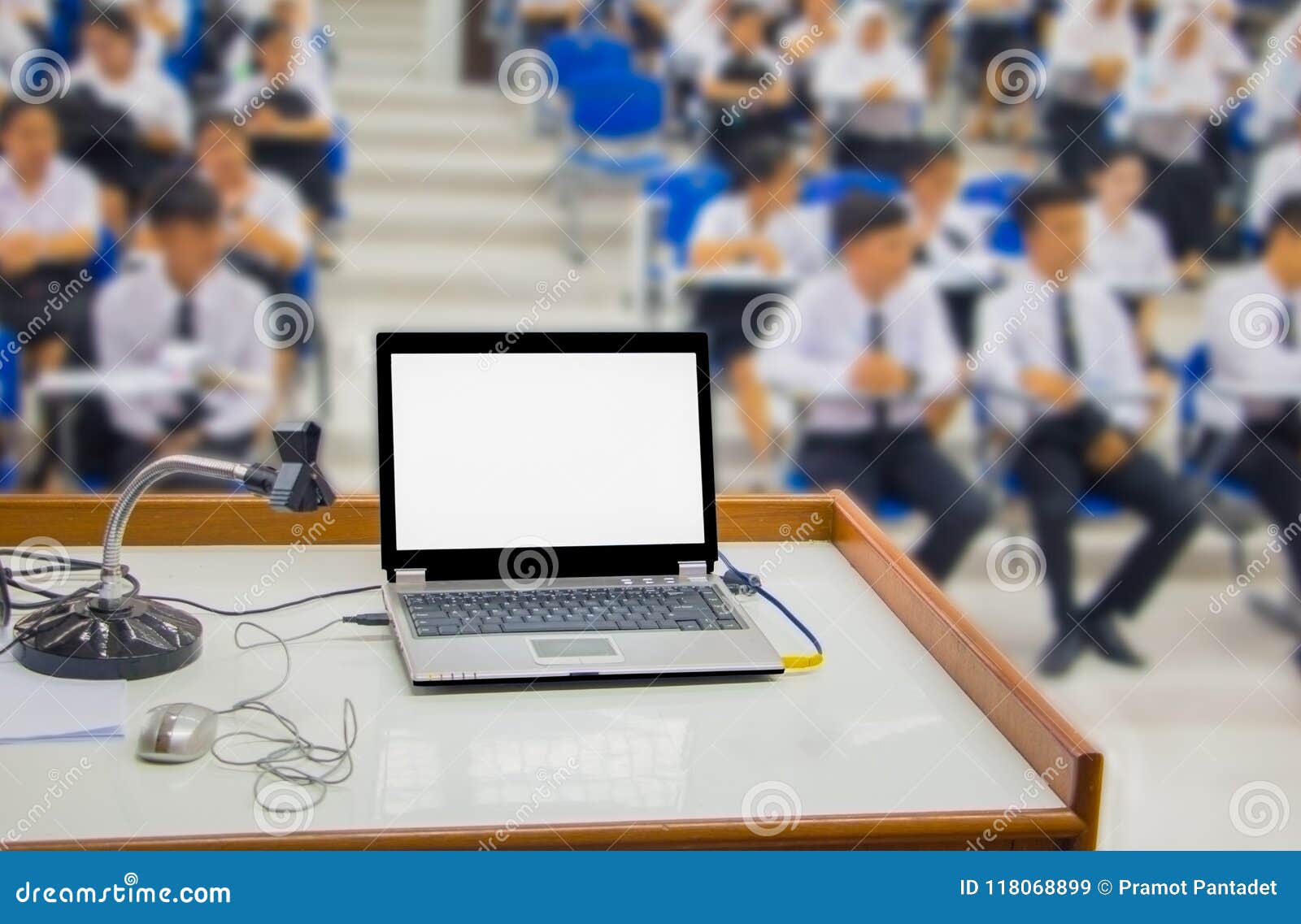 Computer on the Table and Group Students Blur Sitting in the a ...