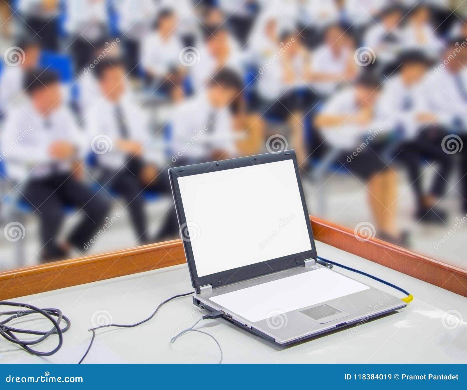 Computer on the Table and Group Students Blur Sitting in the a ...