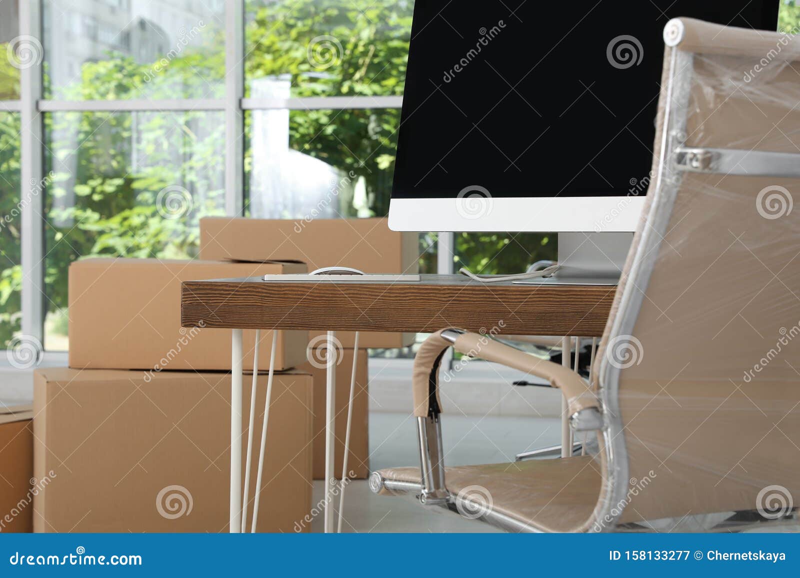 Computer on Table and Packed Stuff in Office Stock Image - Image of ...