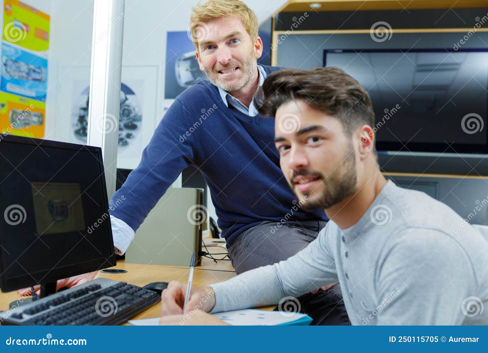 Computer Teacher Assisting Student Stock Image - Image of explaining ...