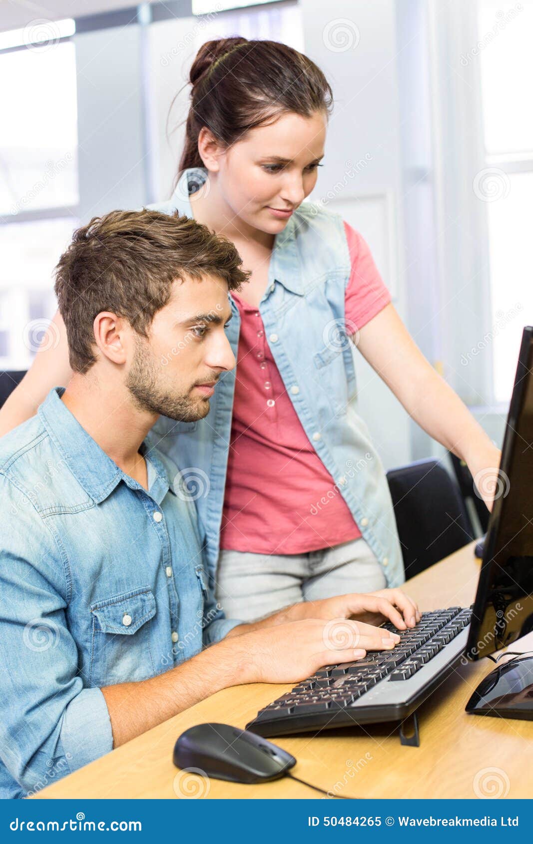 Computer Teacher Helping Pretty Female Student Stock Image - Image of ...