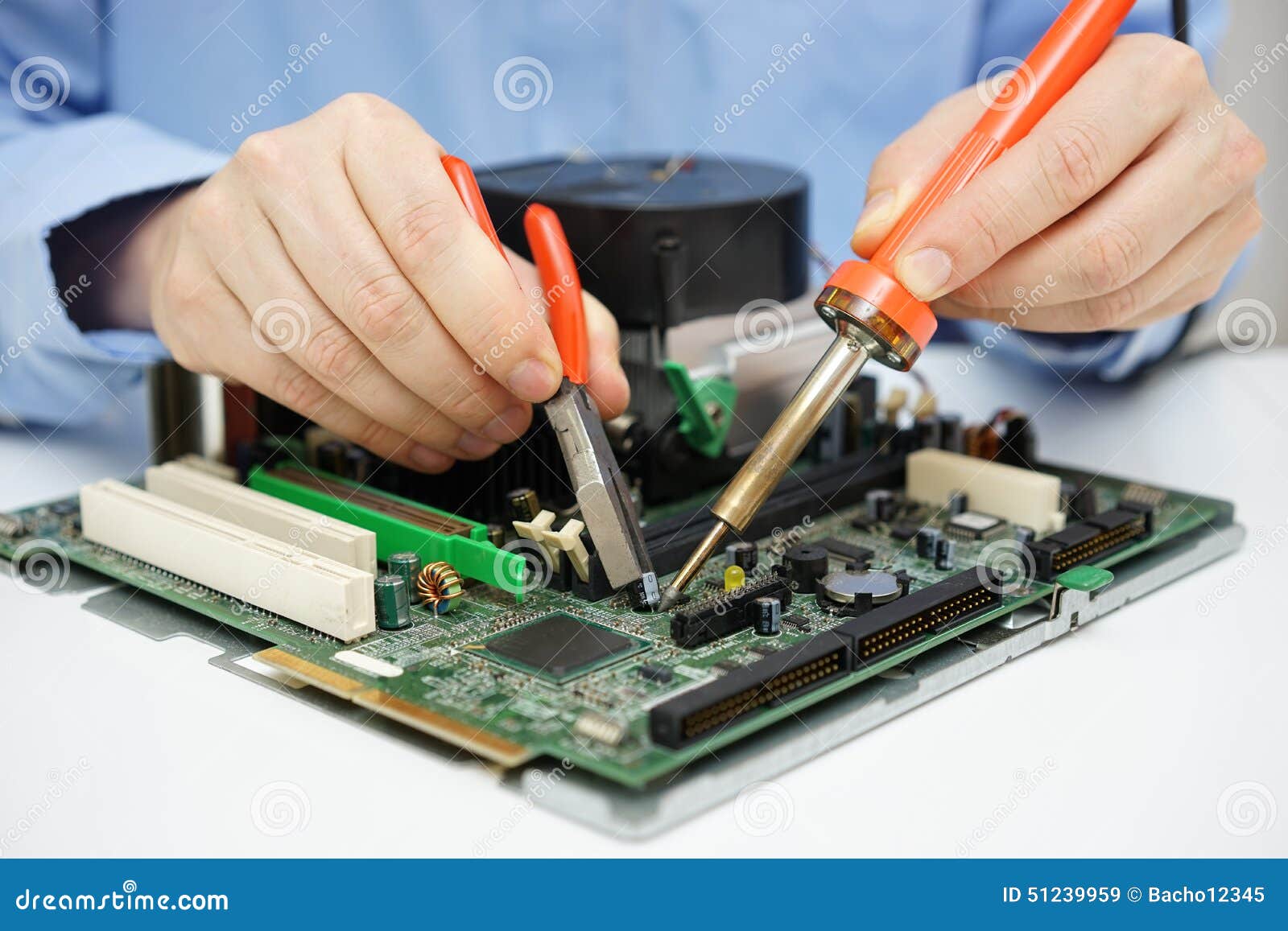 Computer Technician is Changing Capacitor on Faulty Motherboard Stock ...
