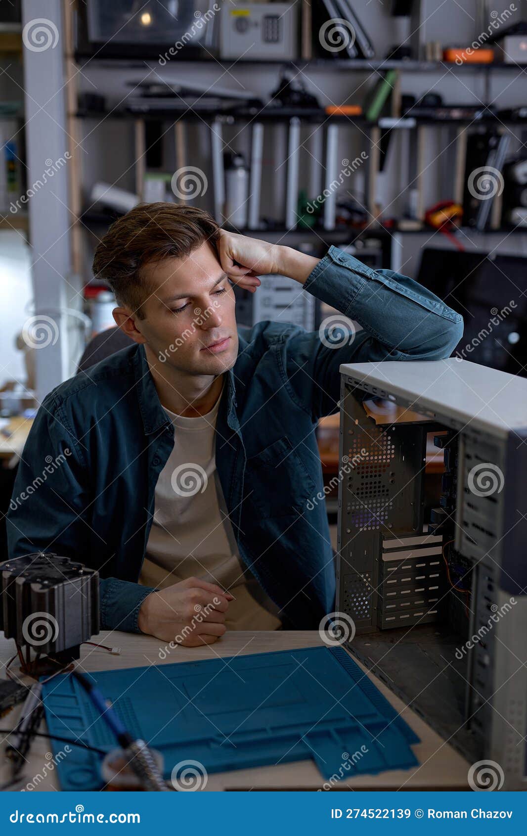 Computer Technician Checking a Computer Component after Disassembling ...