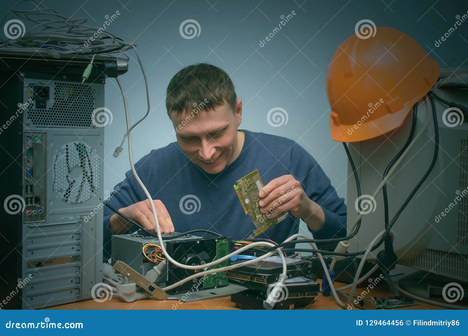 Computer technician. stock photo. Image of hands, card - 129464456