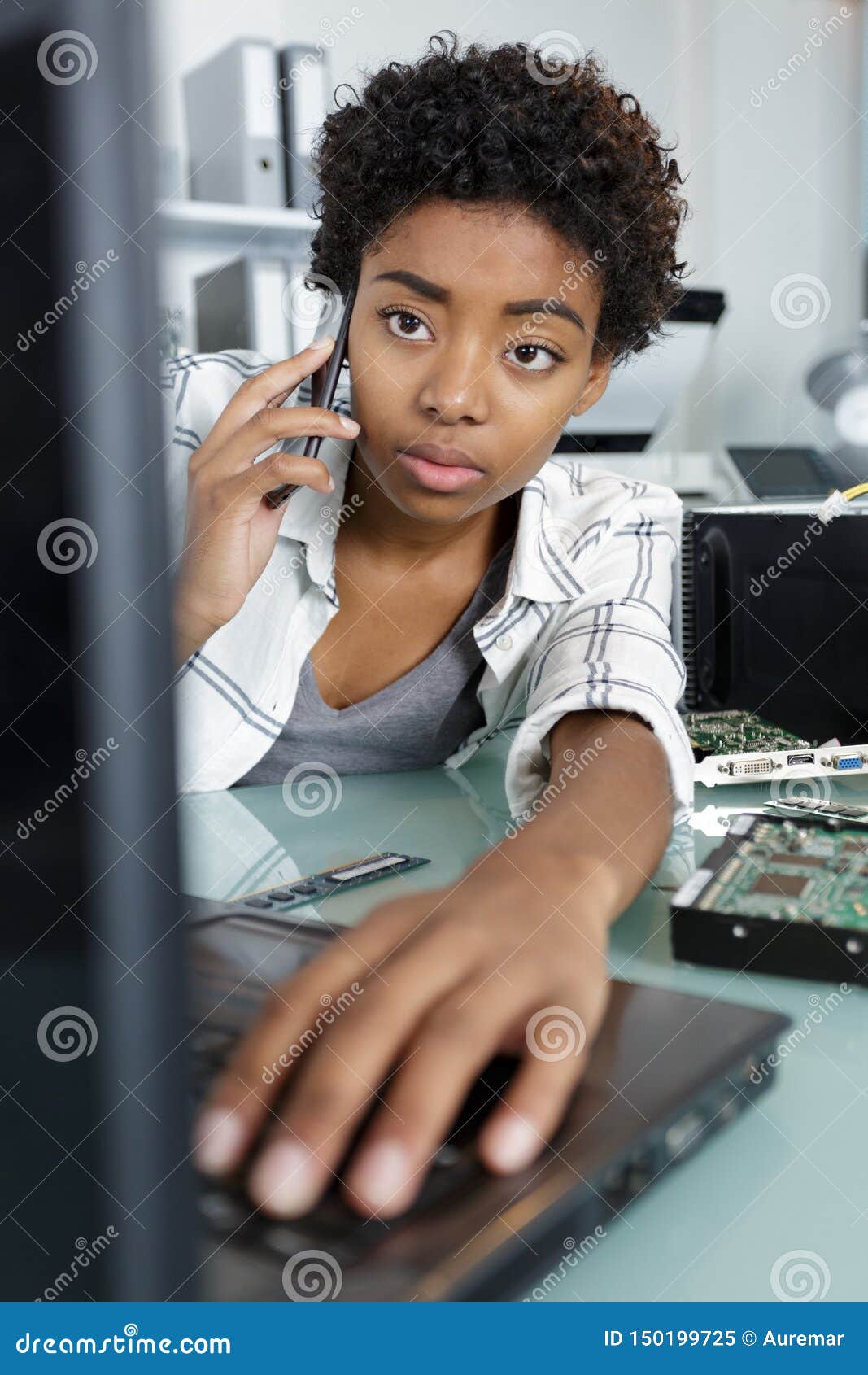 Computer Technician Reaching Forward To Type on Laptop Stock Image ...