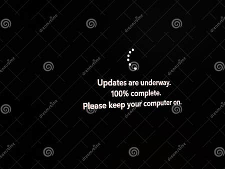 Computer Update Screen with Progress Message and Loading Symbol Stock ...