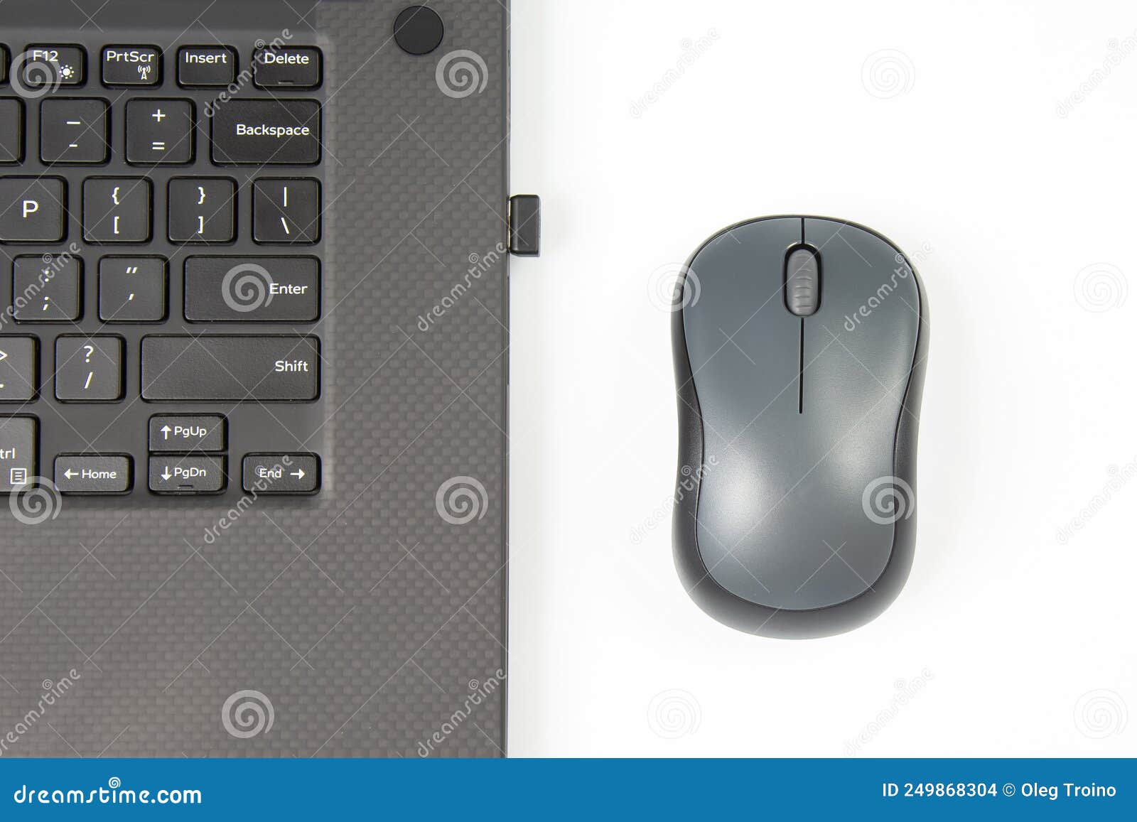 Computer Wireless Mouse Next To a Laptop on a White Table Close-up ...