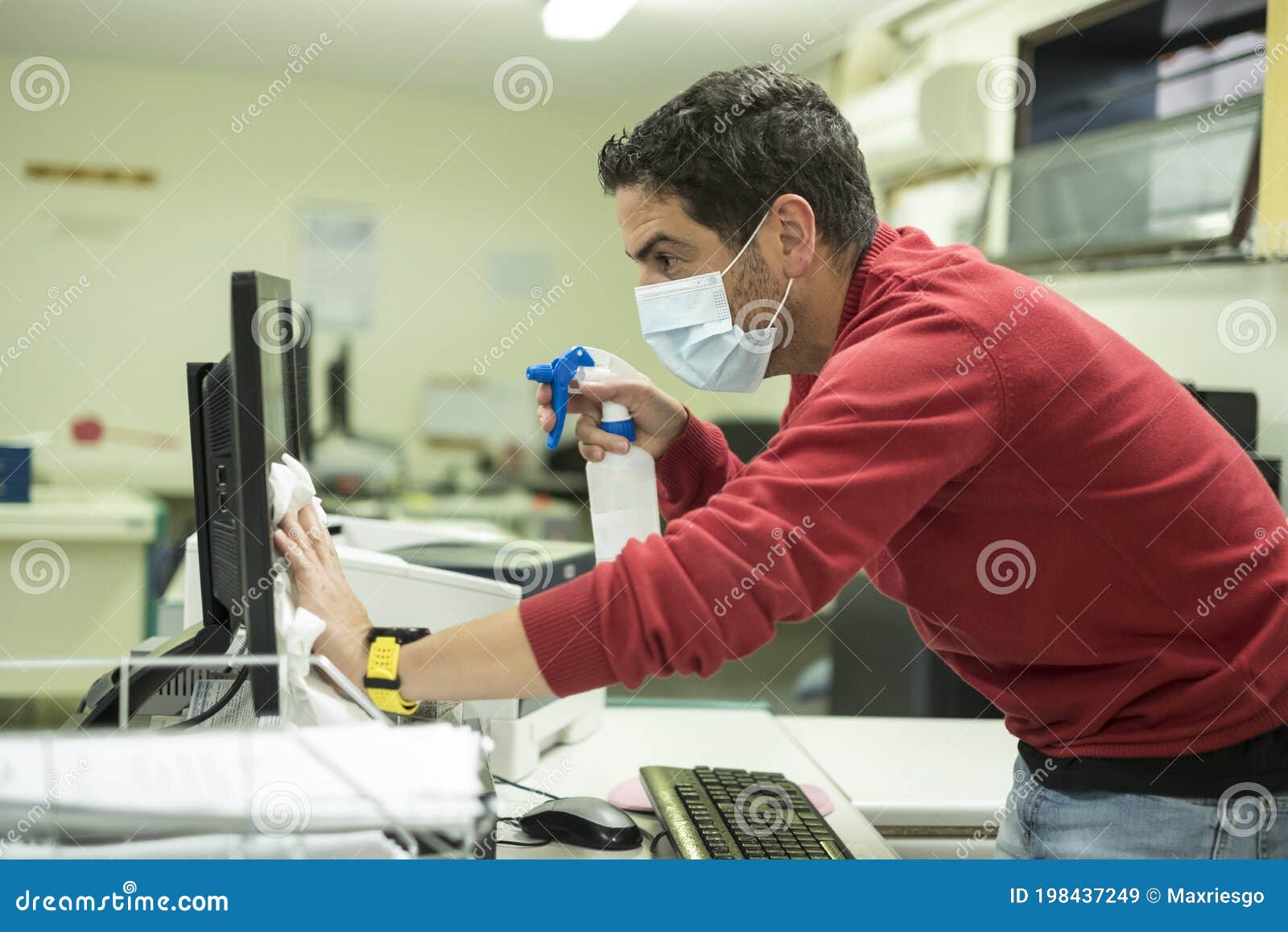 Computer Worker Disinfects His Keyboard and Computer before Working ...